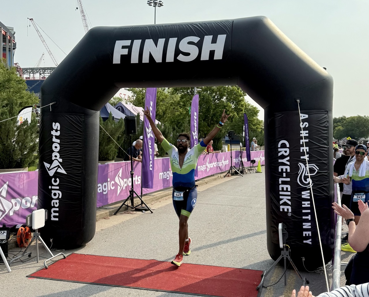 Michael Jordan crossing the finish line at his triathlon race